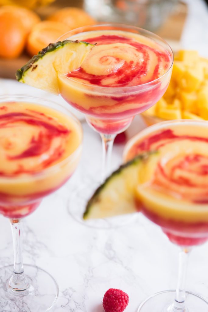 Raspberry Swirl Pineapple Mango Margaritas - The Sweetest Occasion